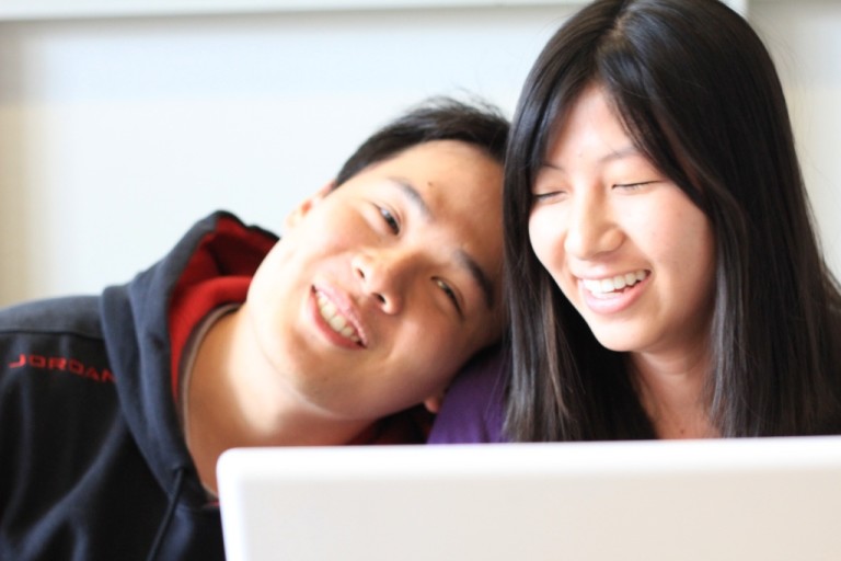 James Mao '12 and Angela Meng '12 enjoy a surprise serenade from ...